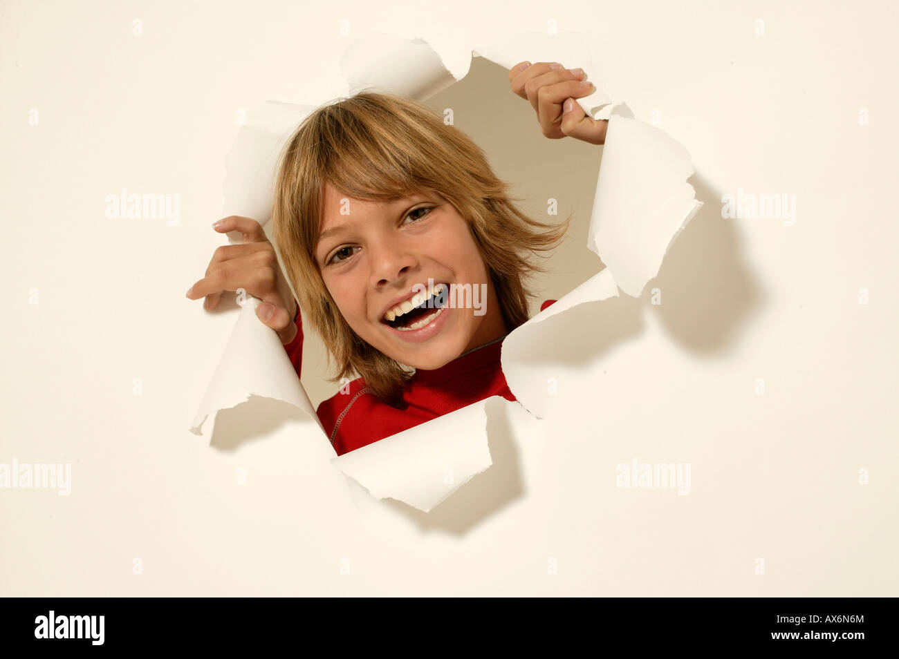 Through paper hi-res stock photography and images - Alamy