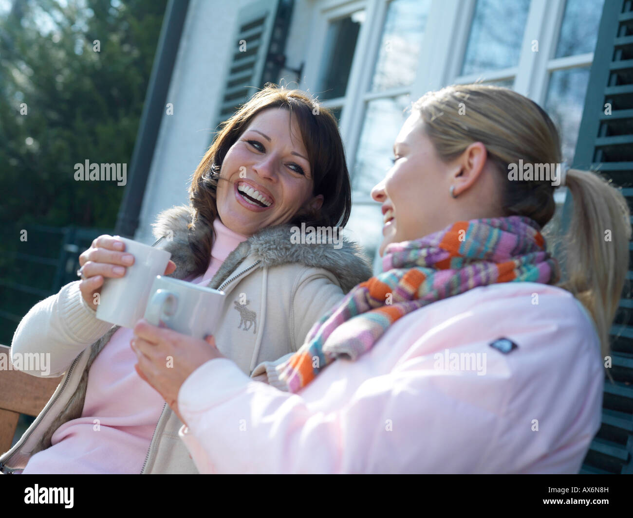 two women sitting outside Stock Photo - Alamy two women sitting outside Stock Photo - Alamy