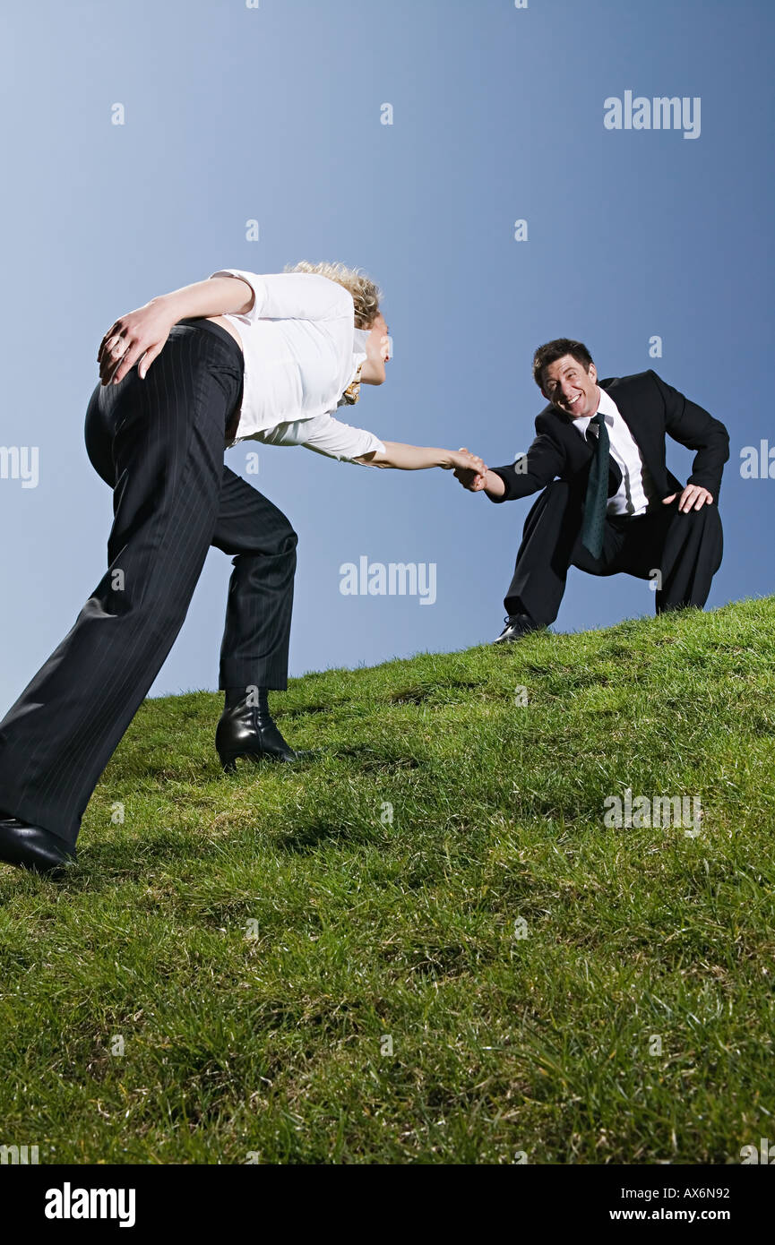 Helping hand businessman reaching hi-res stock photography and images ...