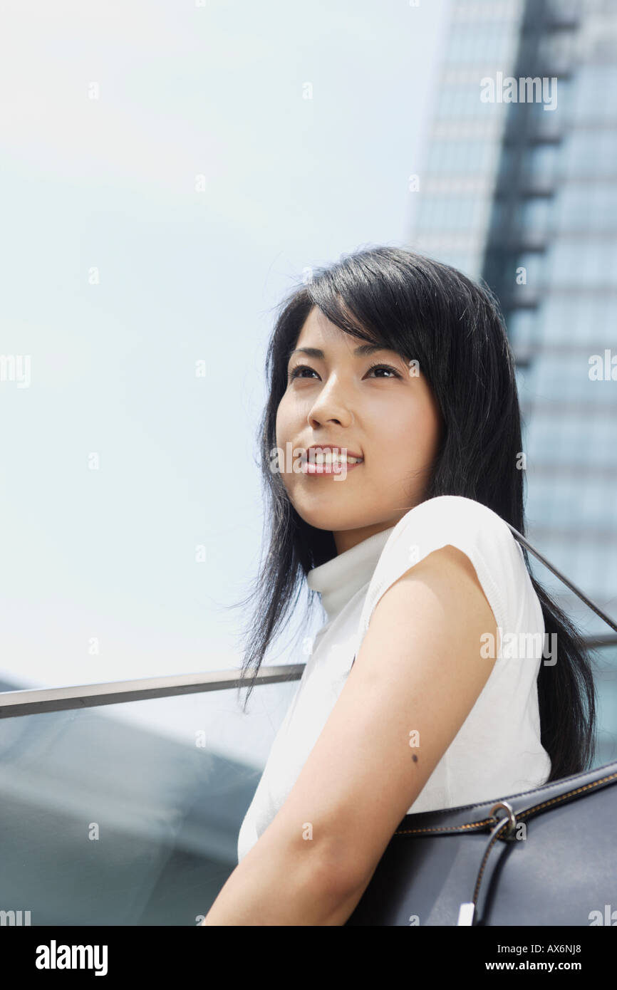 A woman staring at something in bright sunlight Stock Photo - Alamy