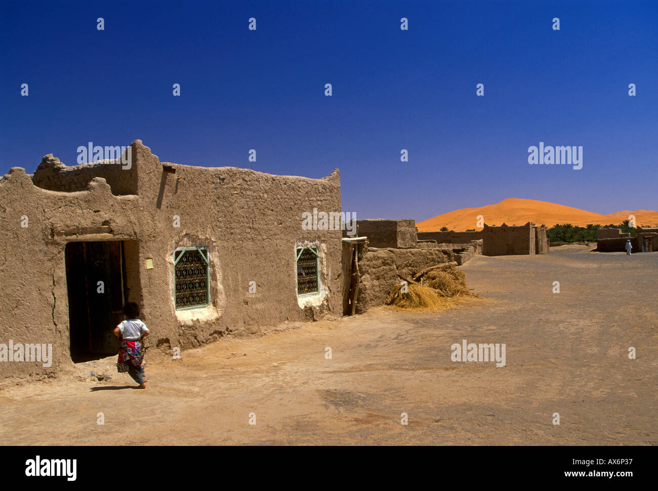 1, one, Moroccan girl, Berber girl, child, adobe home, adobe house ...