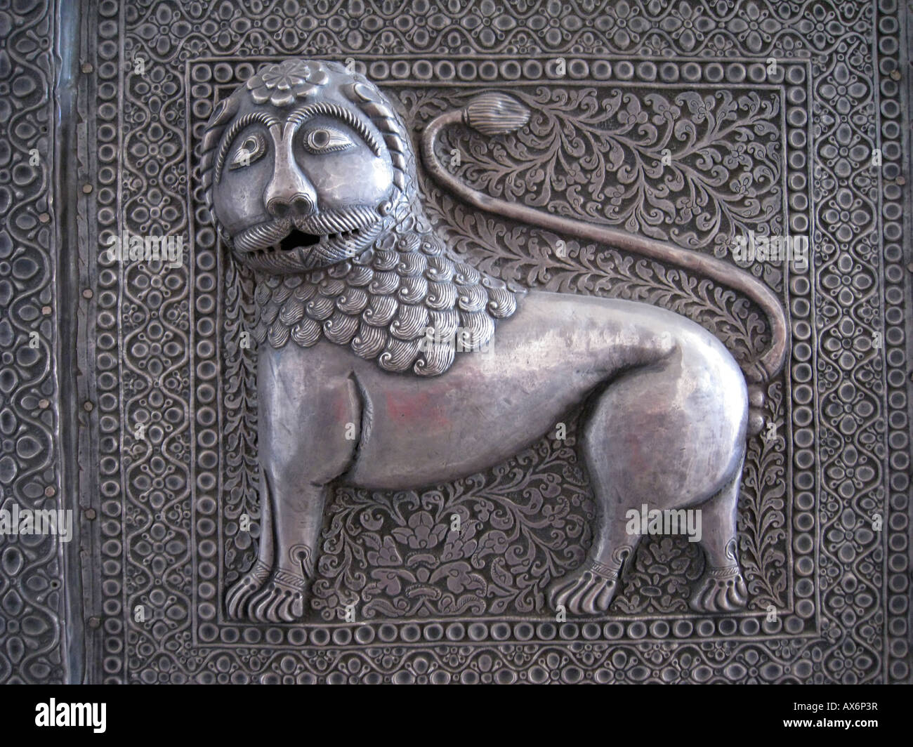 Lion relief in sliver on elephant howdah Stock Photo - Alamy