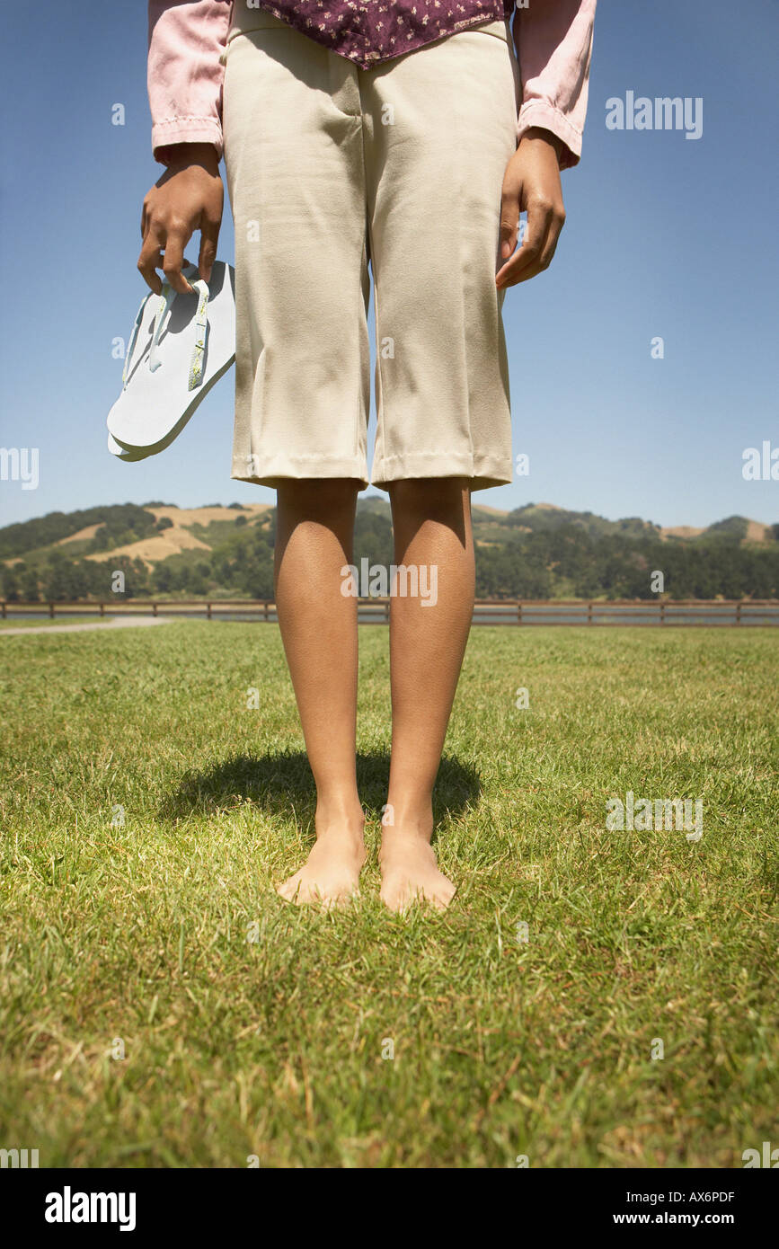 Holding sandals hi-res stock photography and images - Alamy