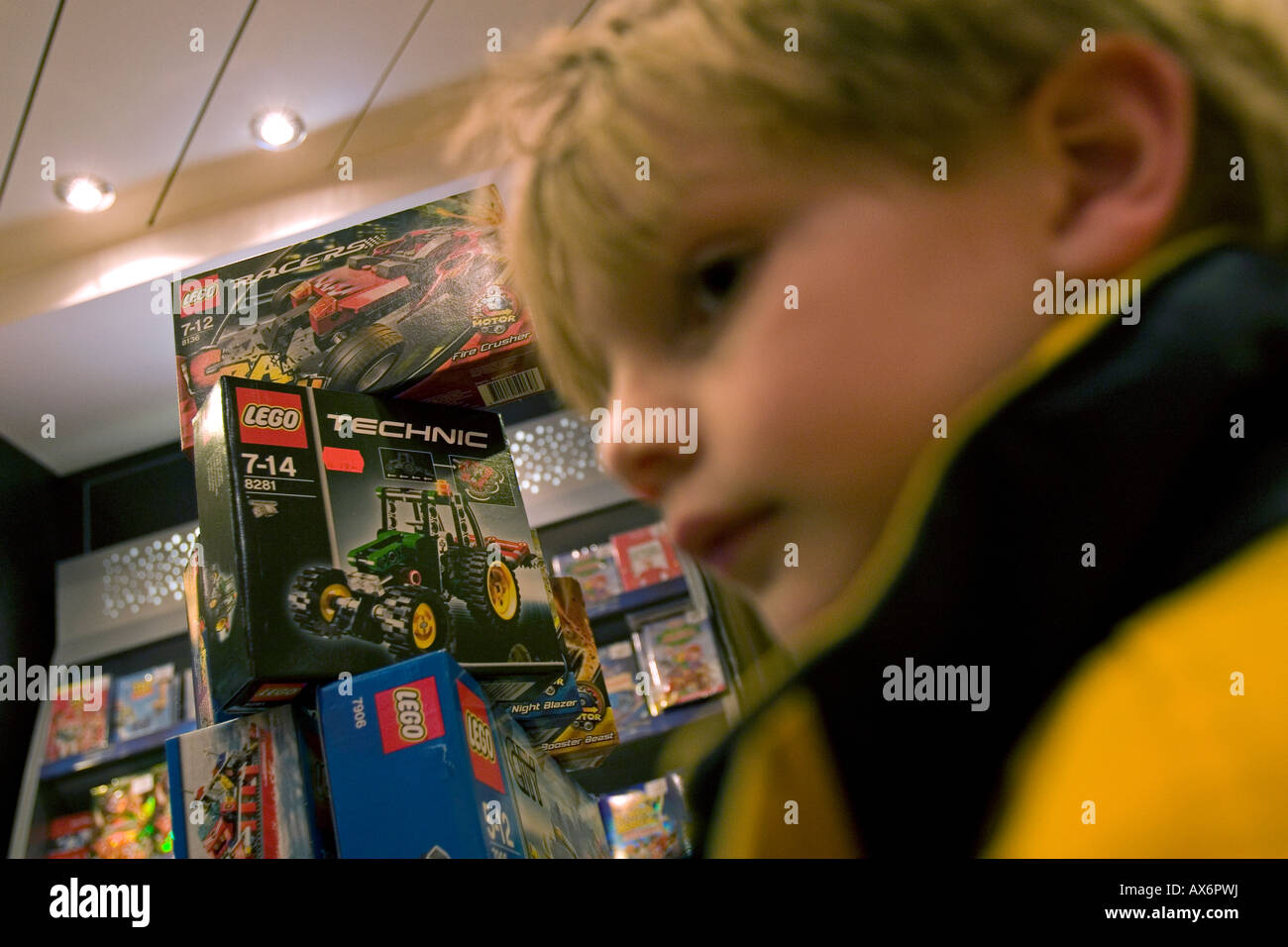 Little boy and LEGO in shop Stock Photo - Alamy