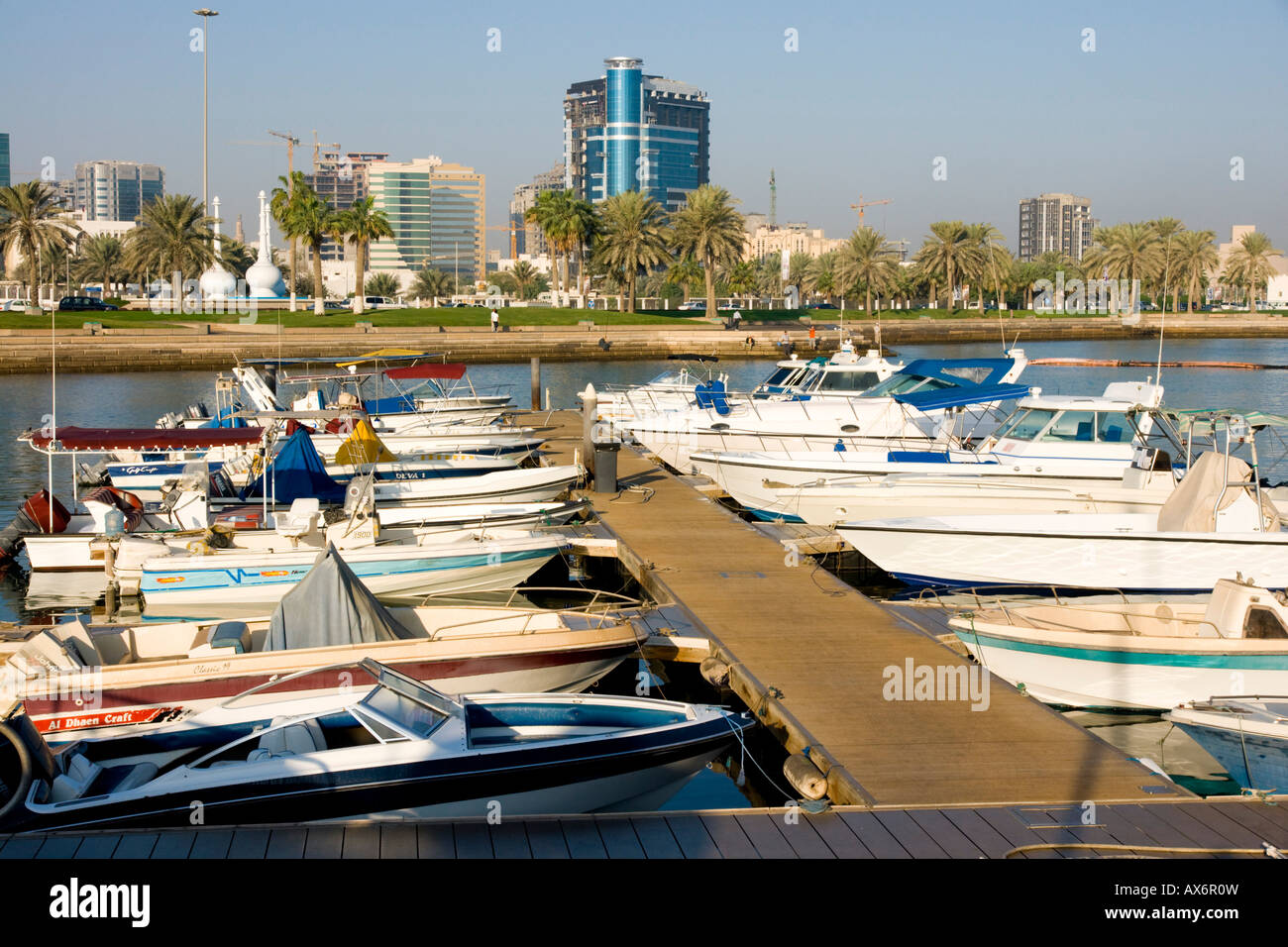 Boats at dock with buildings in background Doha Qatar Stock Photo - Alamy