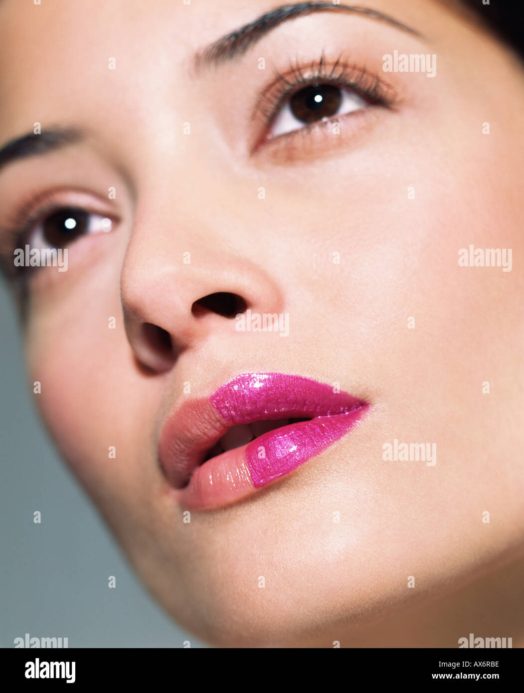 Woman with half of her mouth painted Stock Photo - Alamy