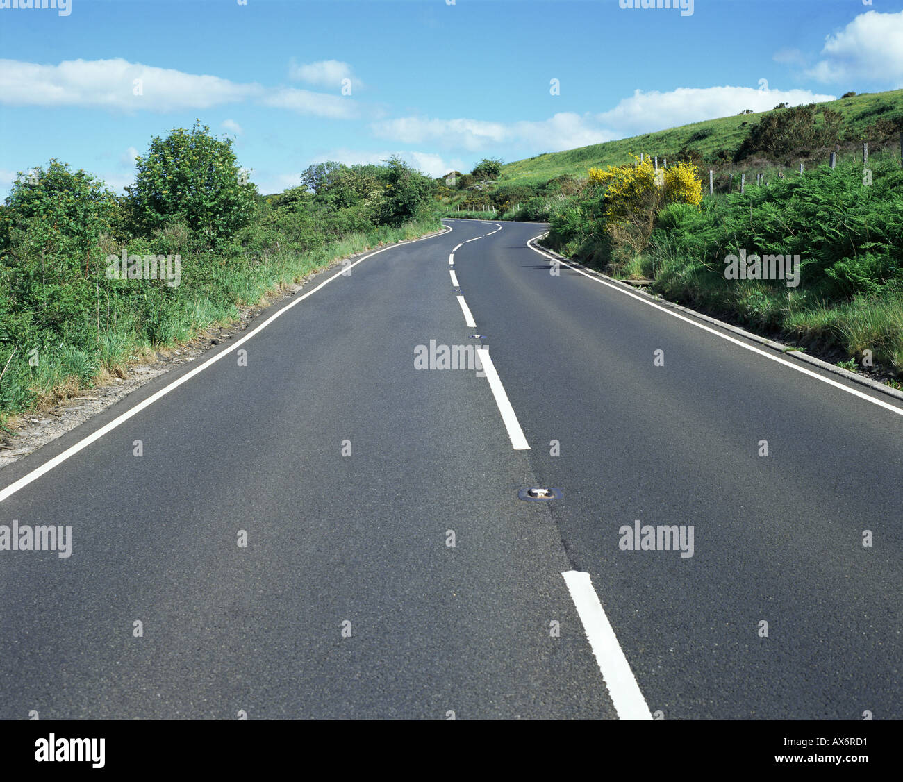 Road through the countryside Stock Photo - Alamy