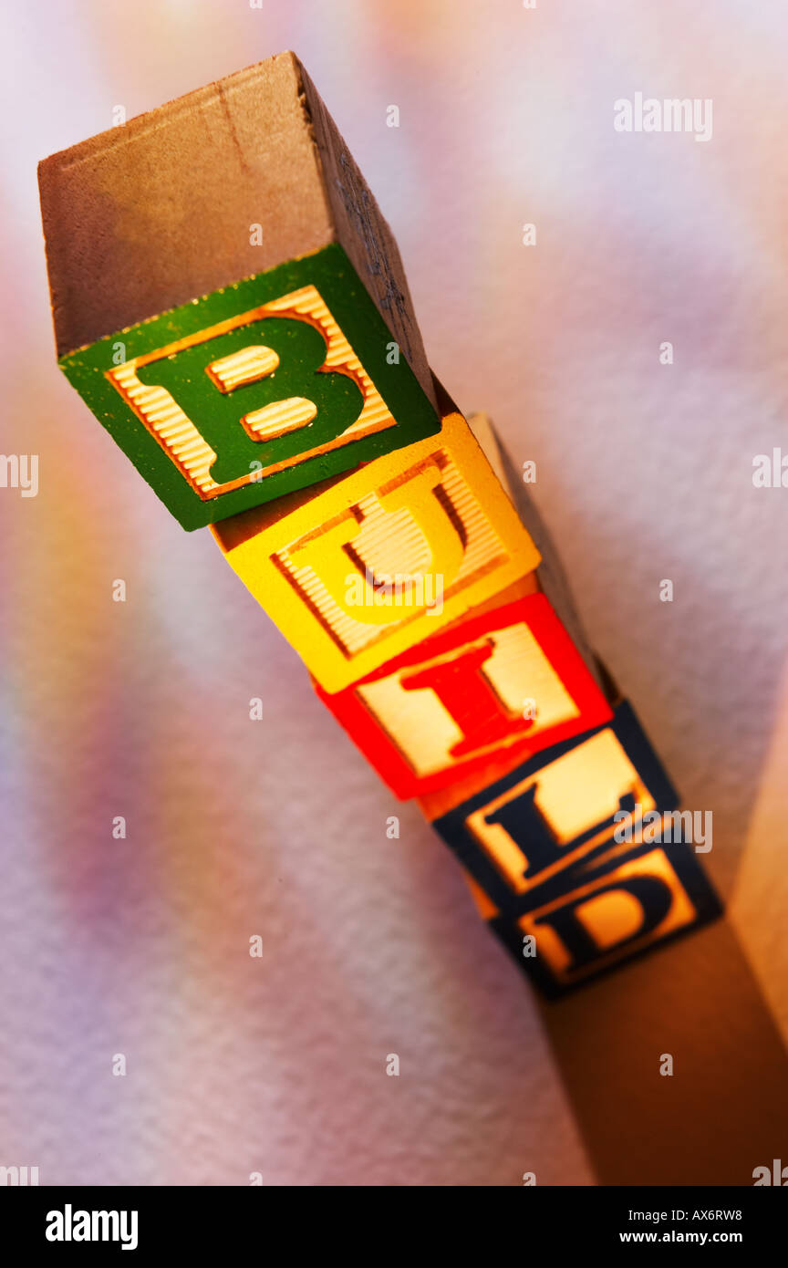 STACK OF WOODEN TOY BUILDING BLOCKS SPELLING THE WORD BUILD Stock Photo ...