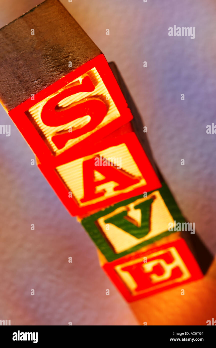 STACK OF WOODEN TOY BUILDING BLOCKS SPELLING THE WORD SAVE Stock Photo ...