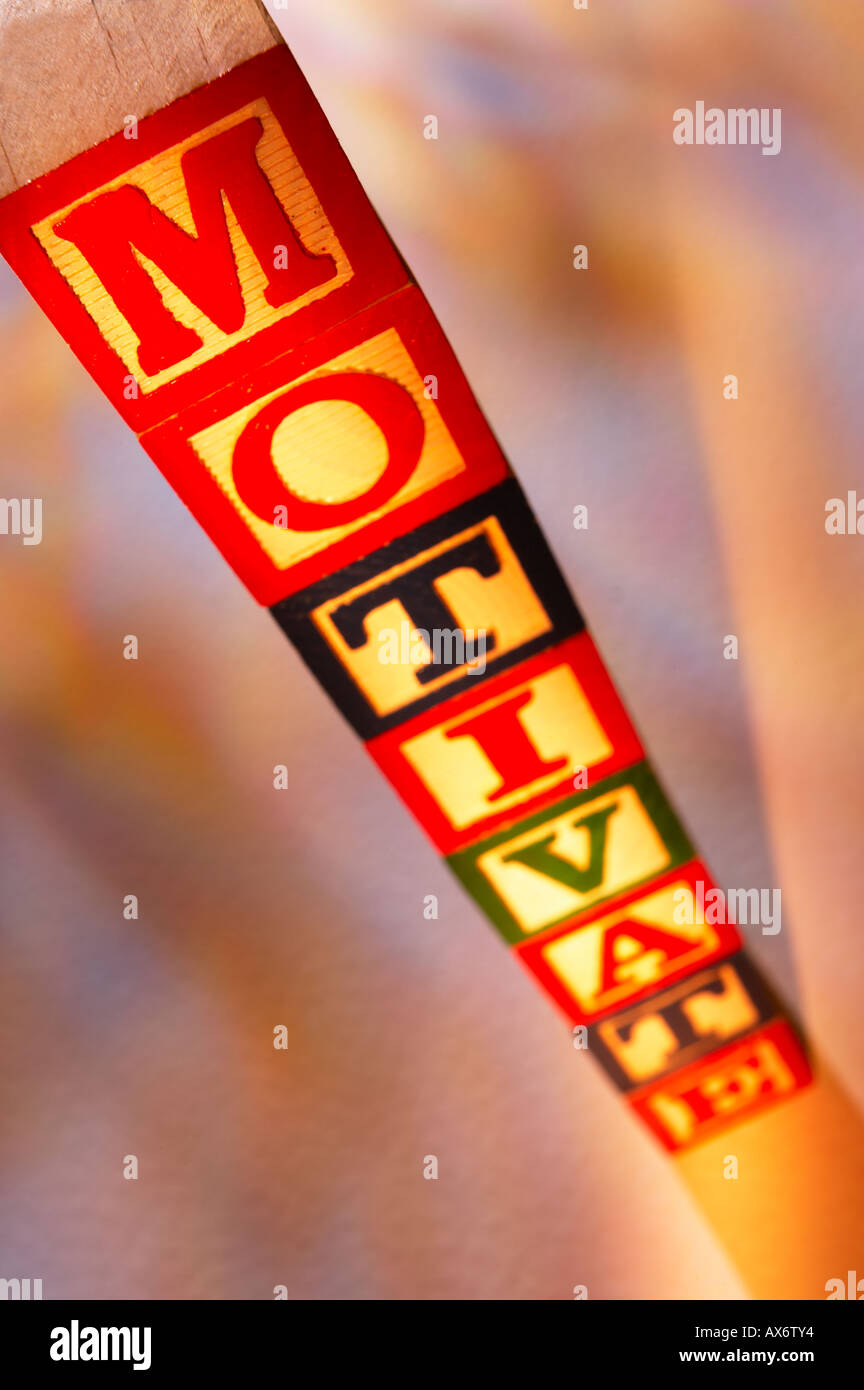 STACK OF WOODEN TOY BUILDING BLOCKS SPELLING THE WORD MOTIVATE Stock ...