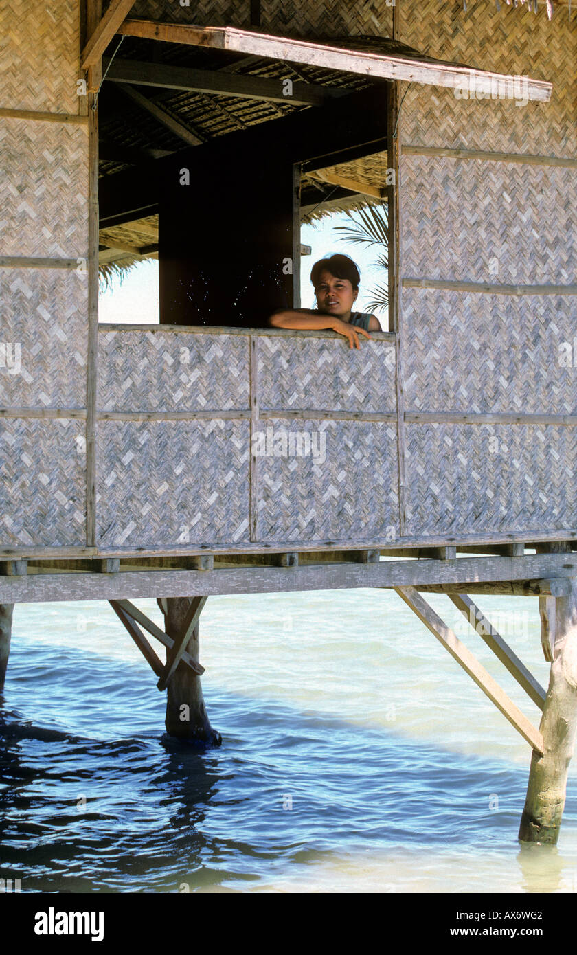 Woman in window of fishing house Argao Cebu Philippines Stock Photo - Alamy