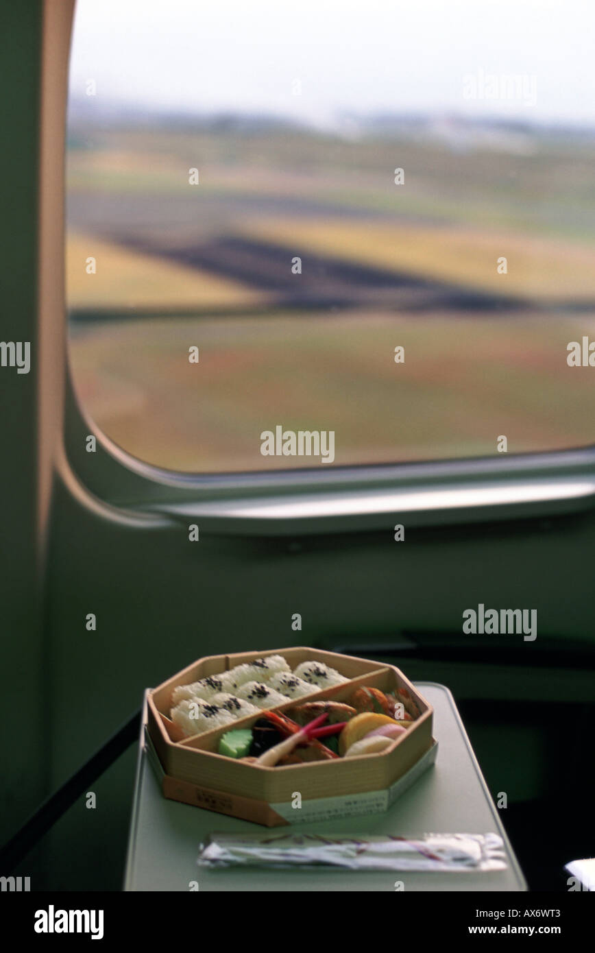 A bento box a typical traditional set Japanese meal sits in the window ...