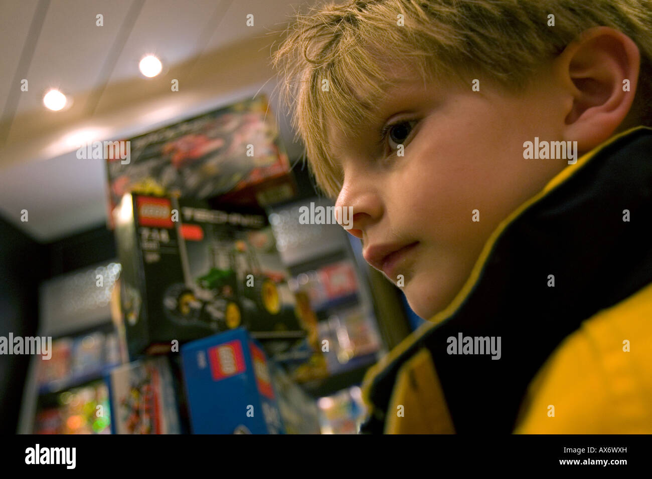 Little boy and LEGO in shop Stock Photo - Alamy