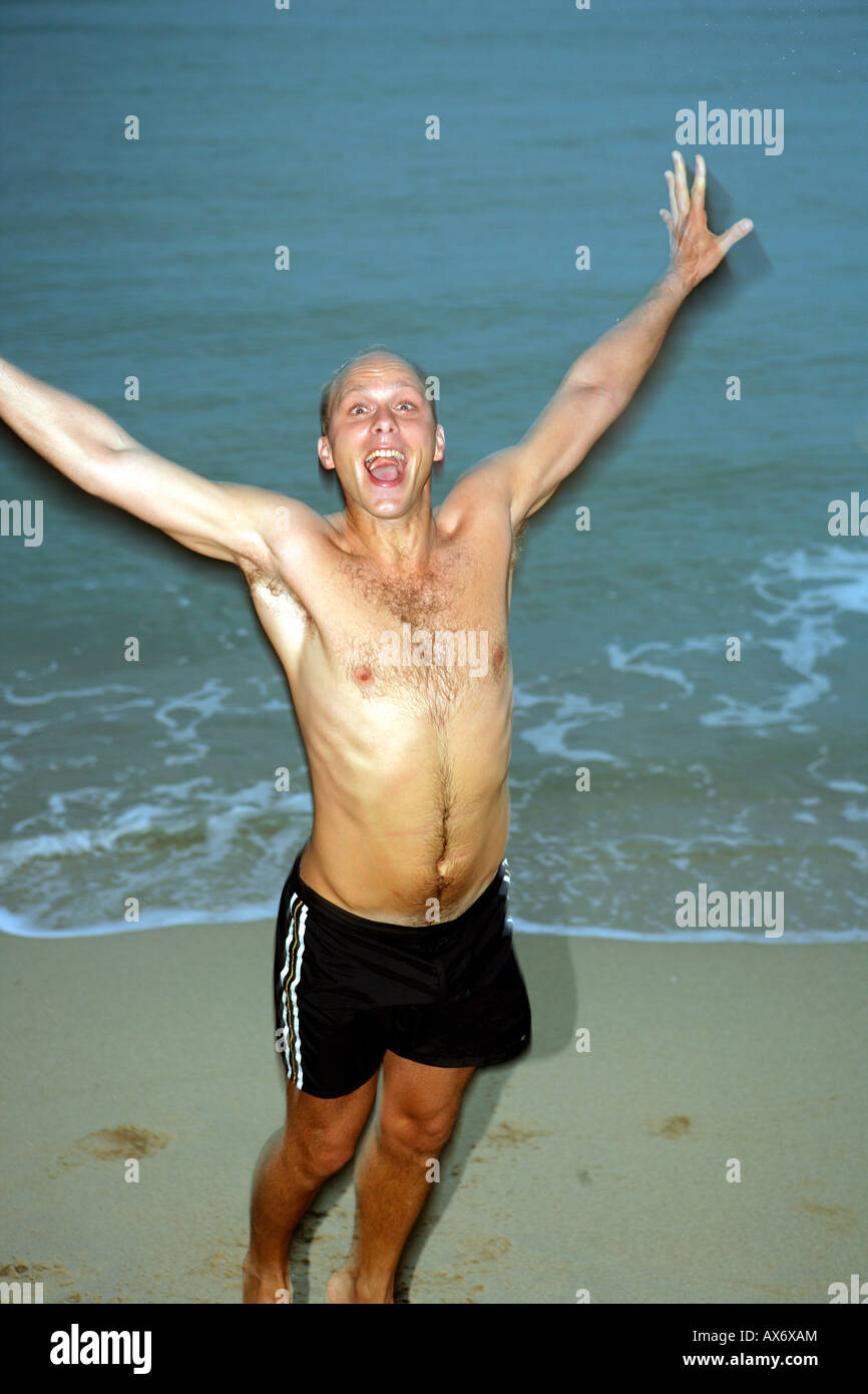 man makes exercise at the beach Stock Photo - Alamy