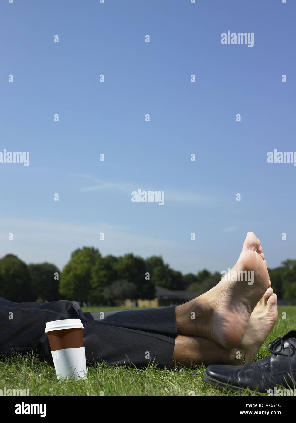 Man sleeping in the park Stock Photo - Alamy