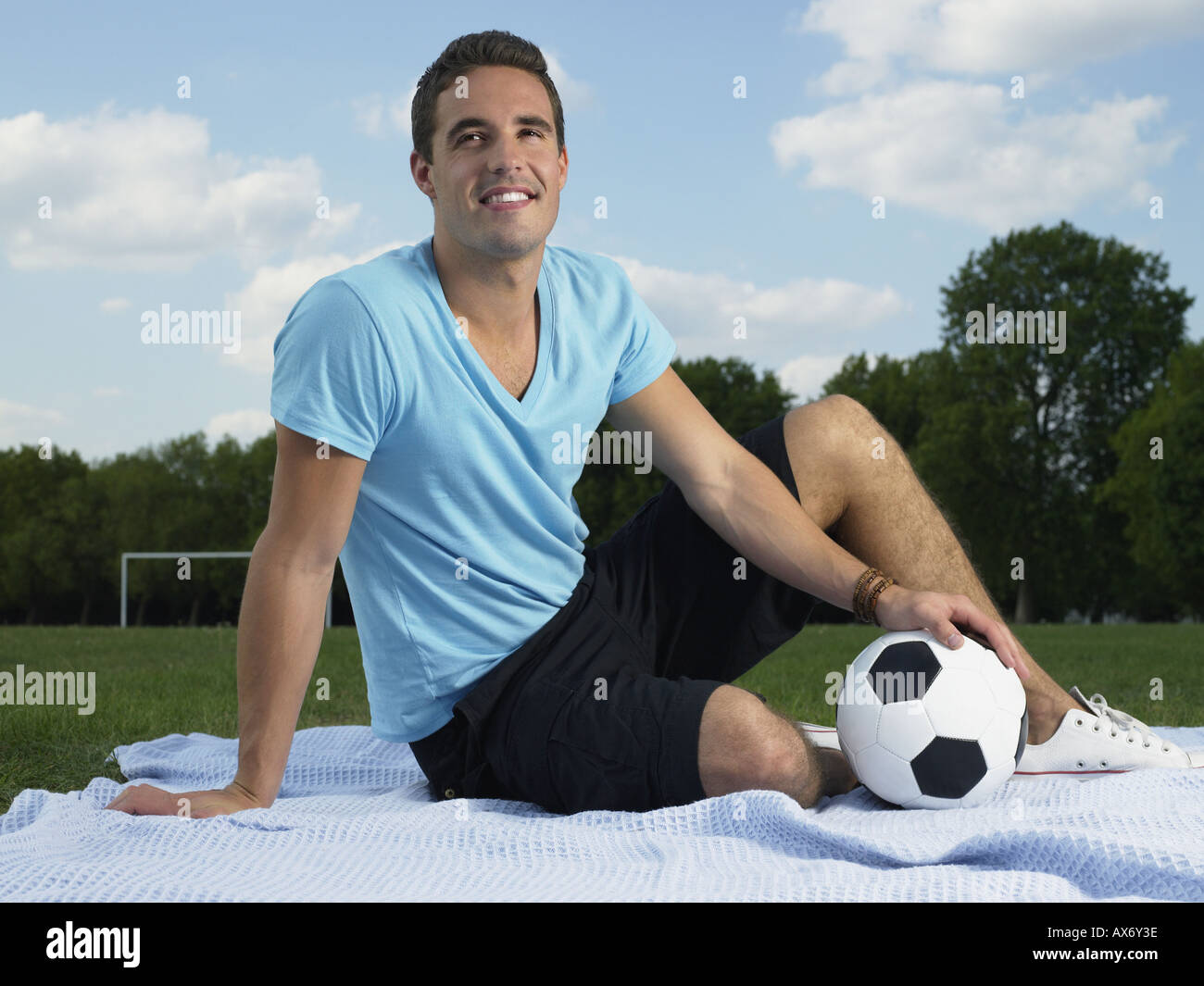 Adults playing soccer in the park hi-res stock photography and images ...