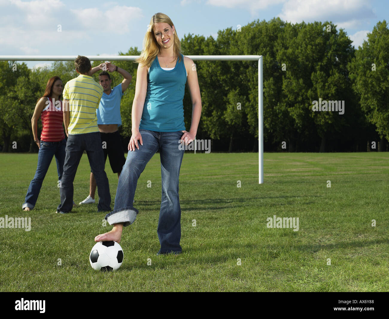 People playing football in the park Stock Photo - Alamy