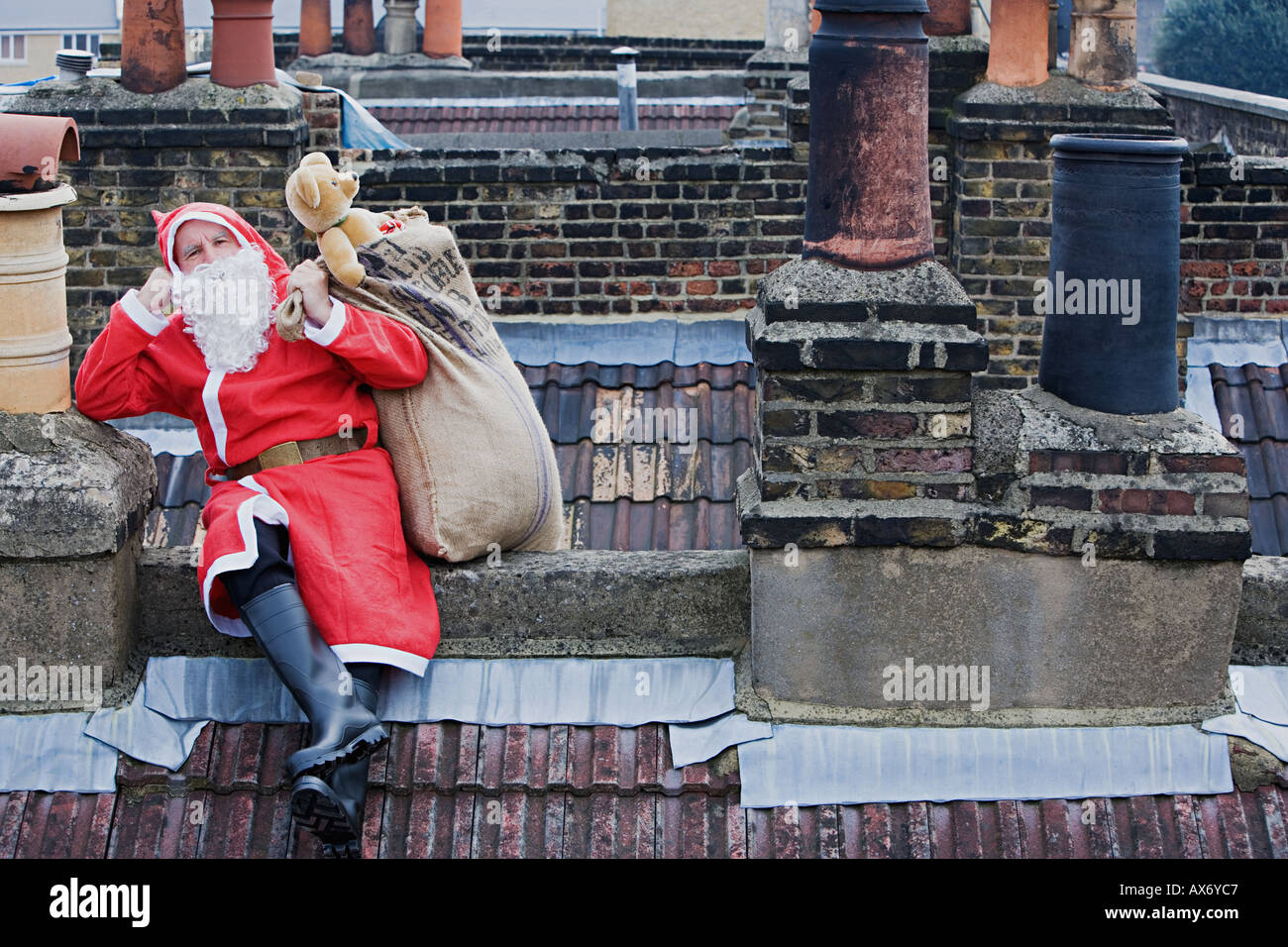 Santa Claus Sitting On Chimney High Resolution Stock Photography and ...