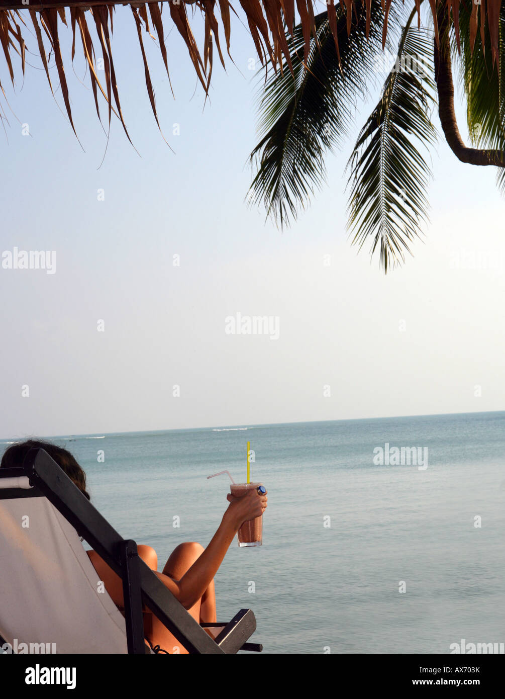 woman with milkshake at the beach Stock Photo - Alamy