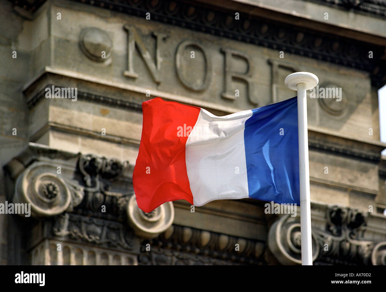 The French flag flying outside the Gare du Nord railway station in ...