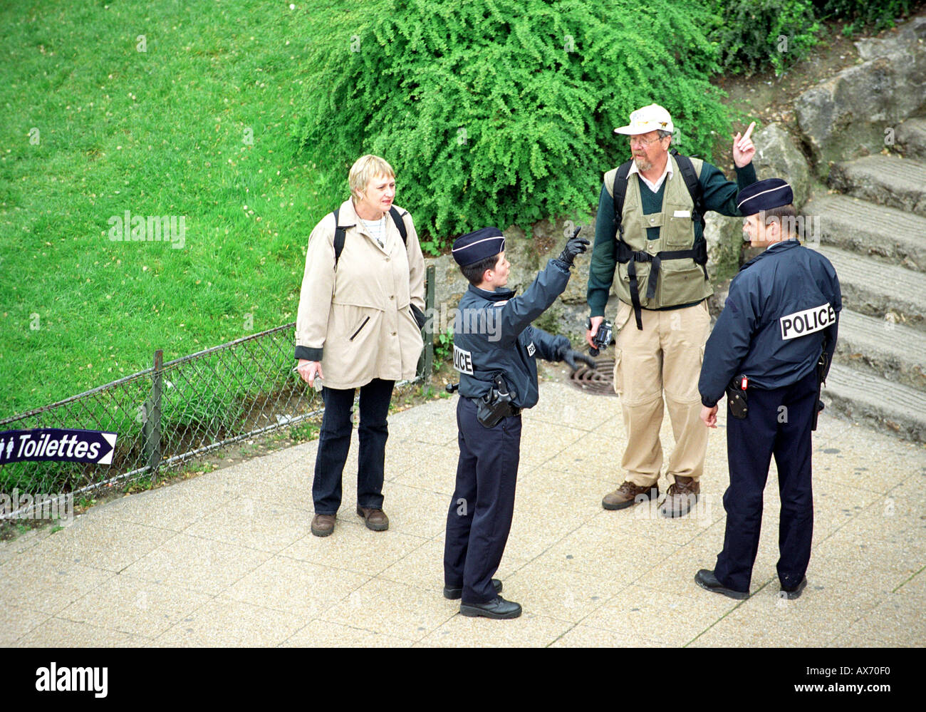French police give directions to tourists in Paris France Stock Photo ...