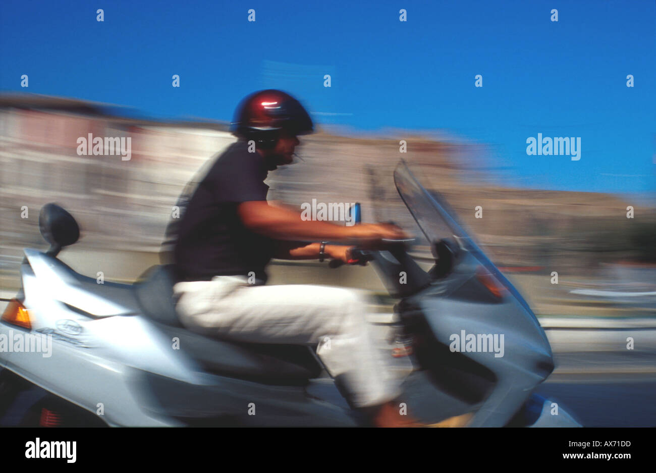 Moped speeding in street hi-res stock photography and images - Alamy