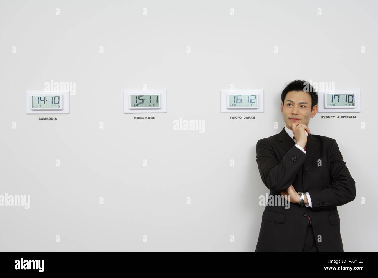 Businessman with time zones Stock Photo - Alamy