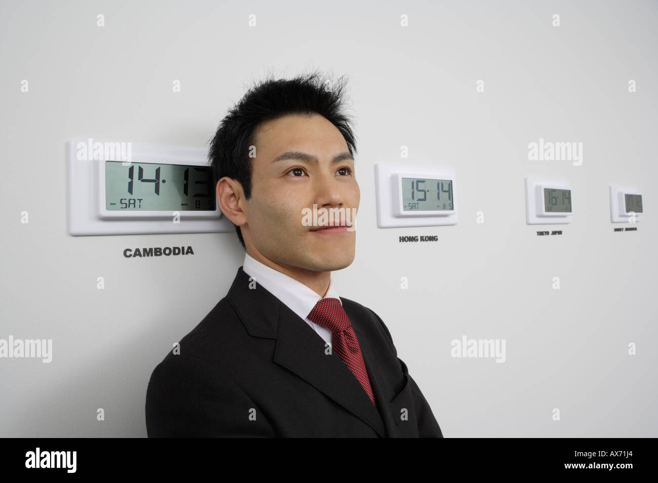 Businessman with time zones, portrait Stock Photo - Alamy
