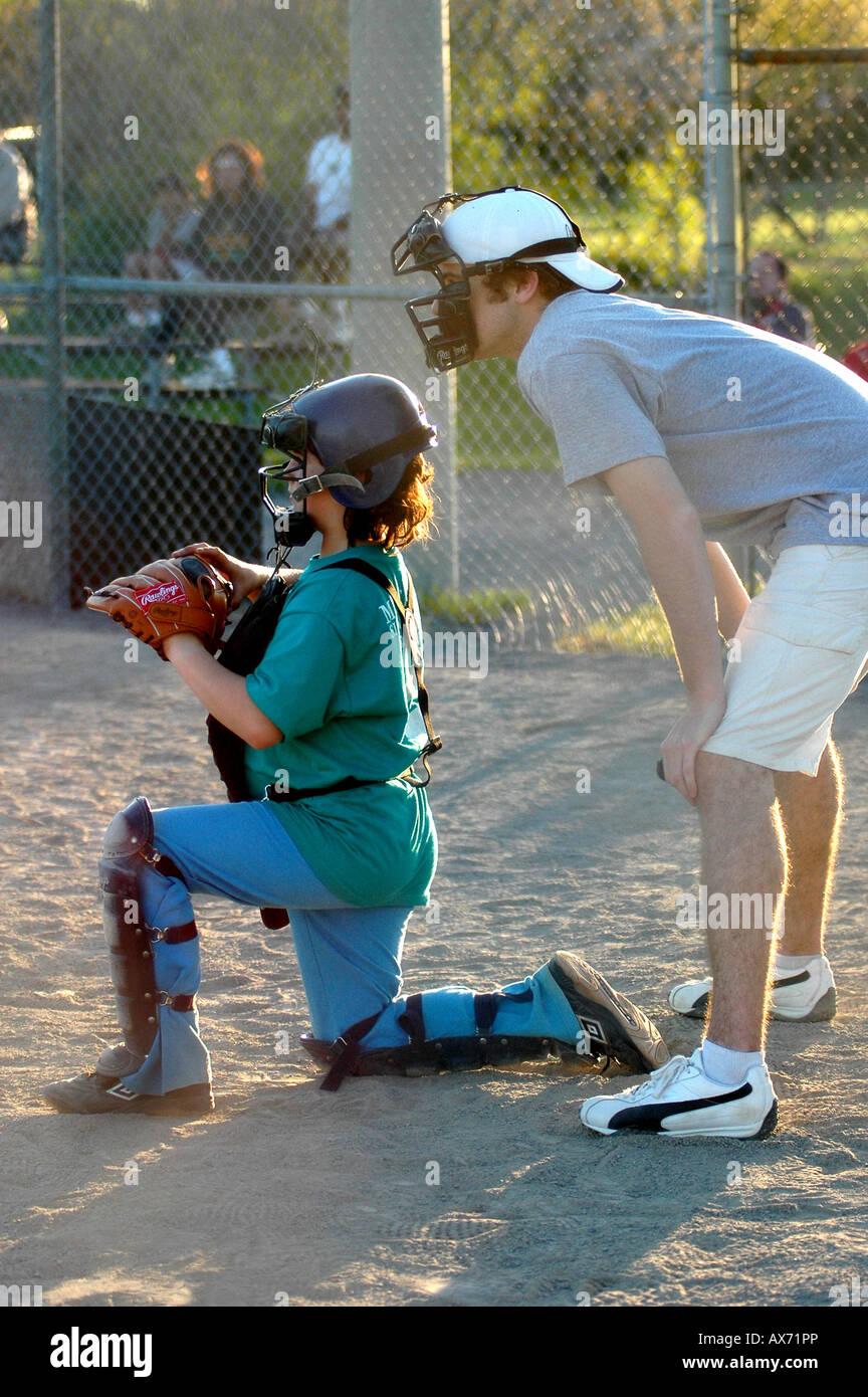 An umpire looks over a catchers shoulder on a baseball field Stock ...
