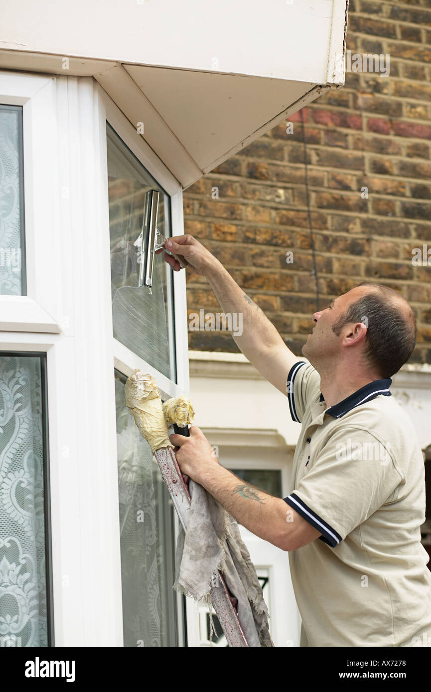 British window cleaner at work in London England UK Stock Photo - Alamy