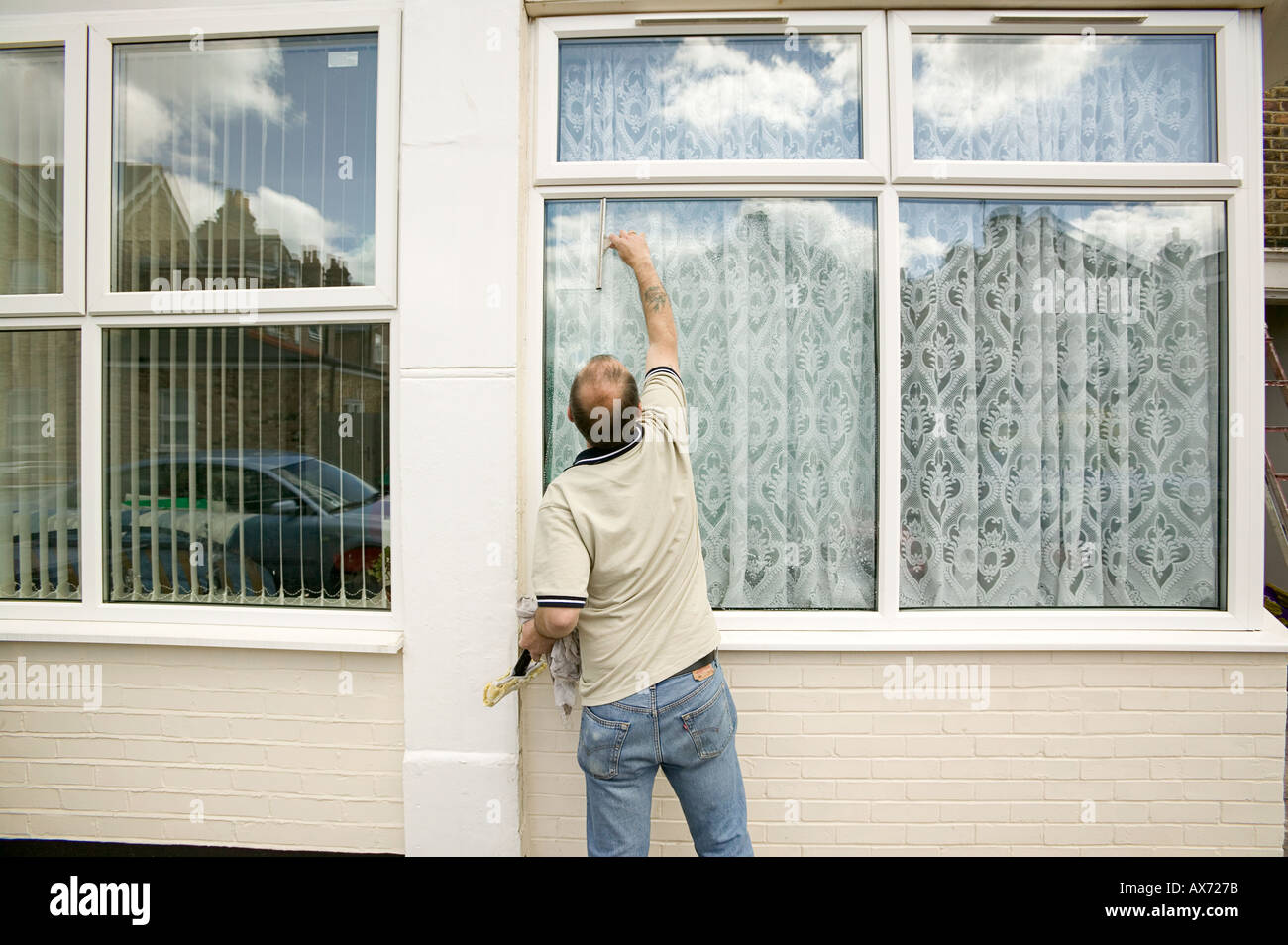 British window cleaner at work in London England UK Stock Photo - Alamy