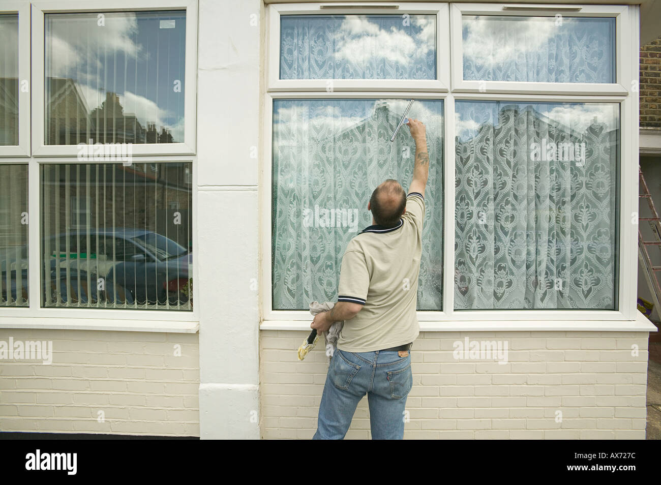 British window cleaner at work in London England UK Stock Photo - Alamy
