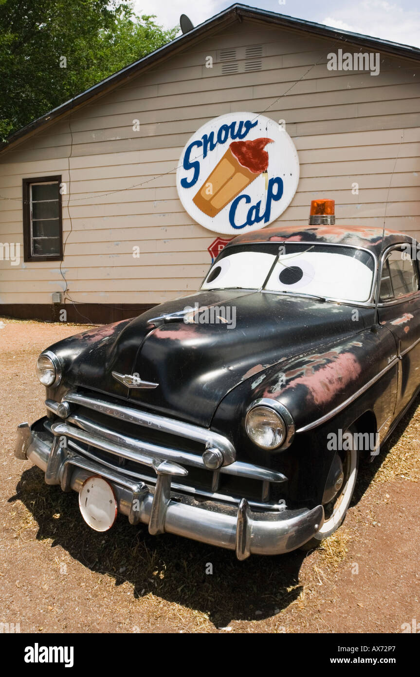 Classic rusting post war black Chevrolet, decorated with eyes to mimic ...