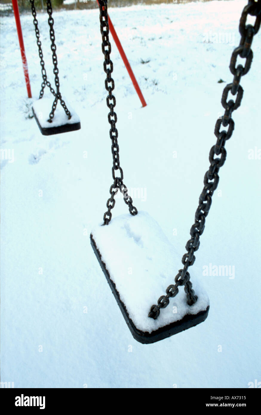 snow covered playground swings Stock Photo - Alamy