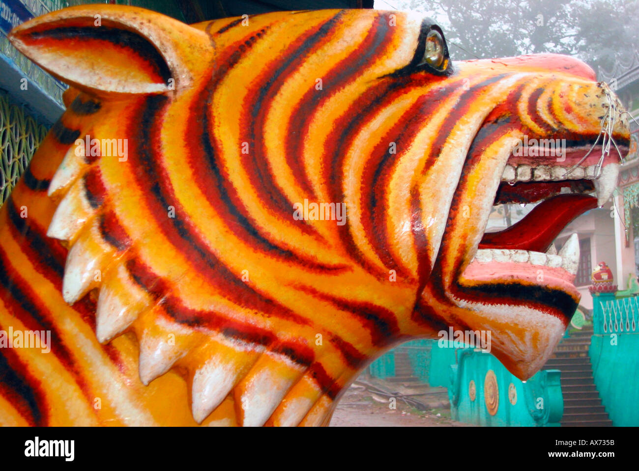 Tiger statue guards entrance to Nat House at base of Mount Popa Myanmar ...