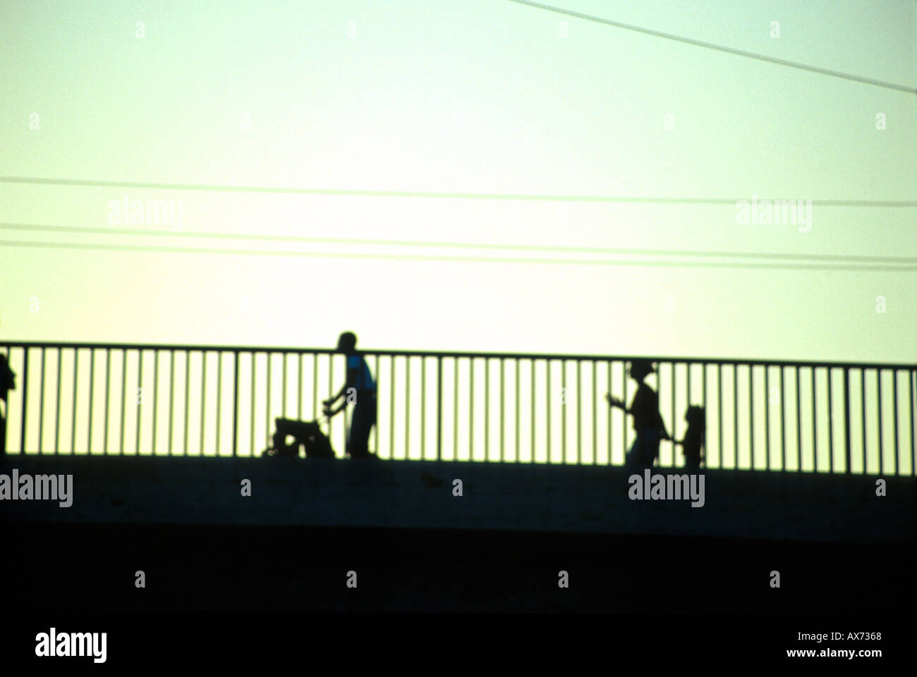 parents with children walking on bridge Stock Photo - Alamy