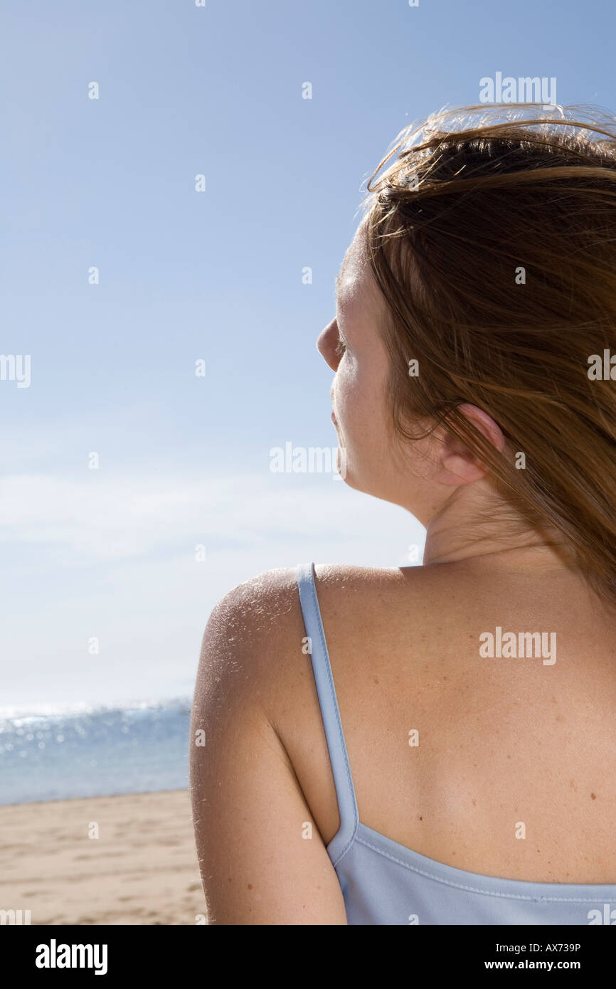 Woman on beach, rear view Stock Photo - Alamy