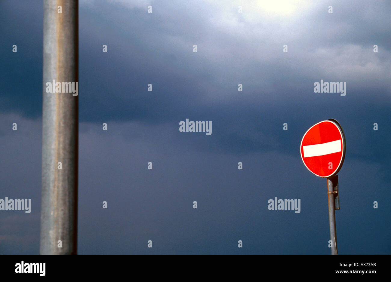 no entry road sign and dark sky Stock Photo - Alamy