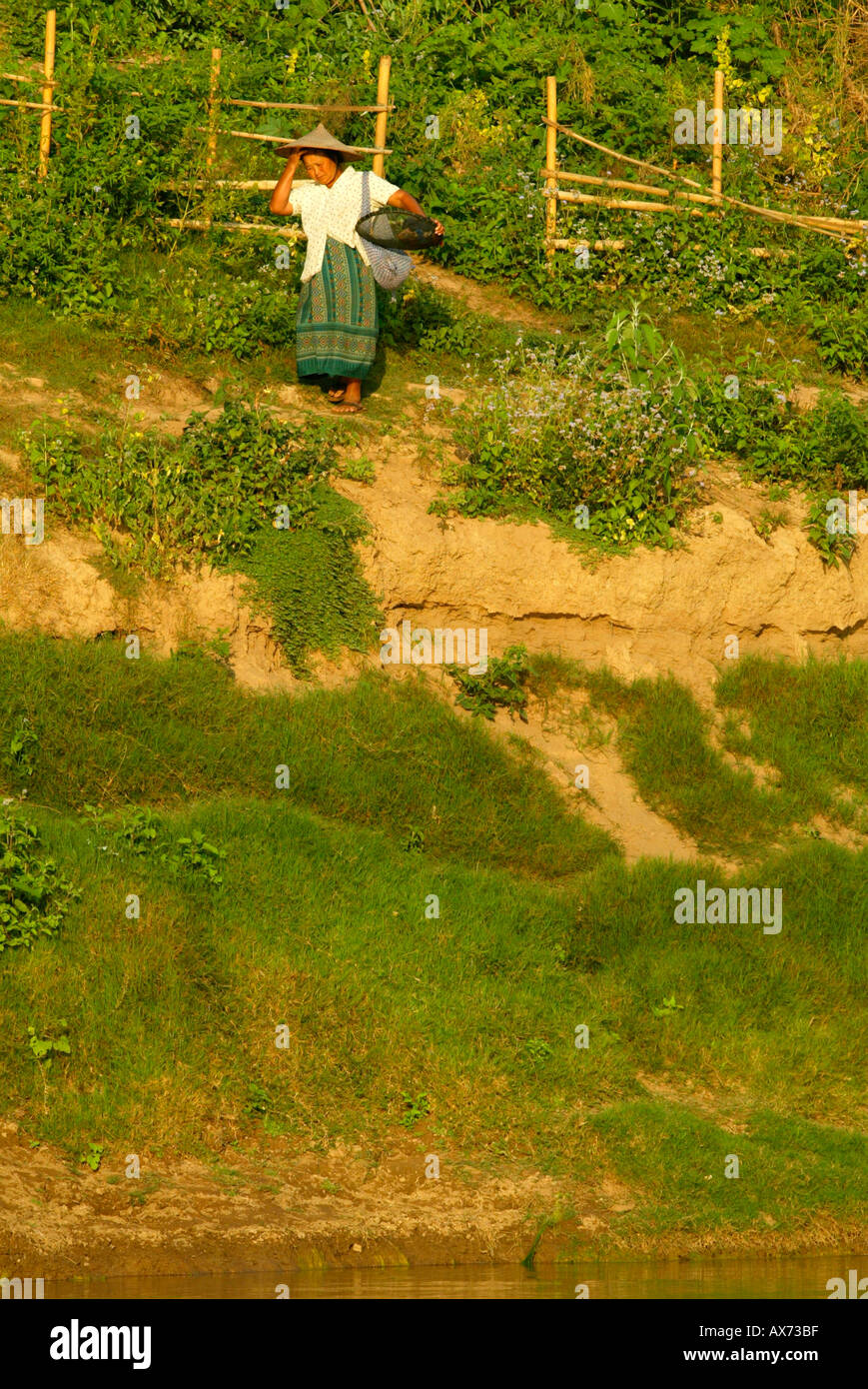 Woman walks along river hi-res stock photography and images - Alamy