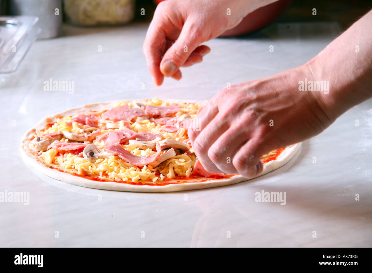 Making an italian pizza Stock Photo - Alamy