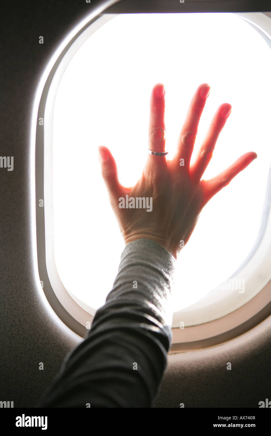 hand at the window of a plane Stock Photo - Alamy