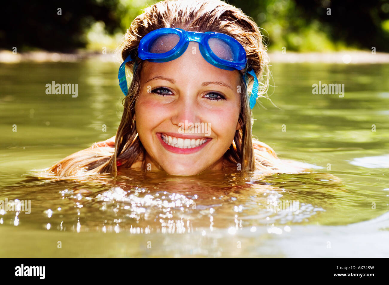 Young woman with goggles, portrait Stock Photo - Alamy