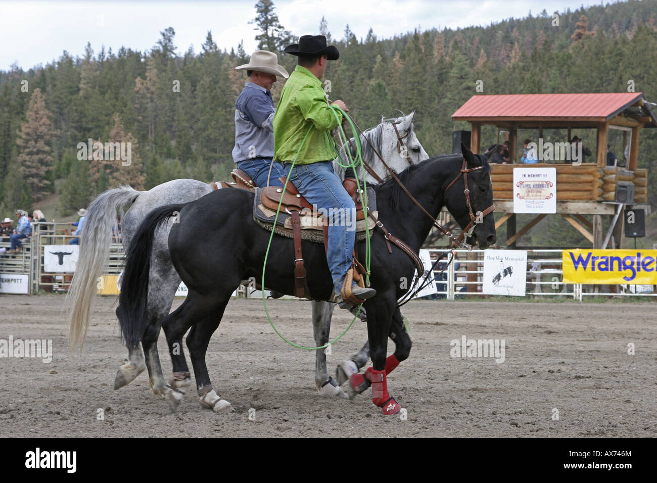 Cowboys at a rodeo Stock Photo - Alamy
