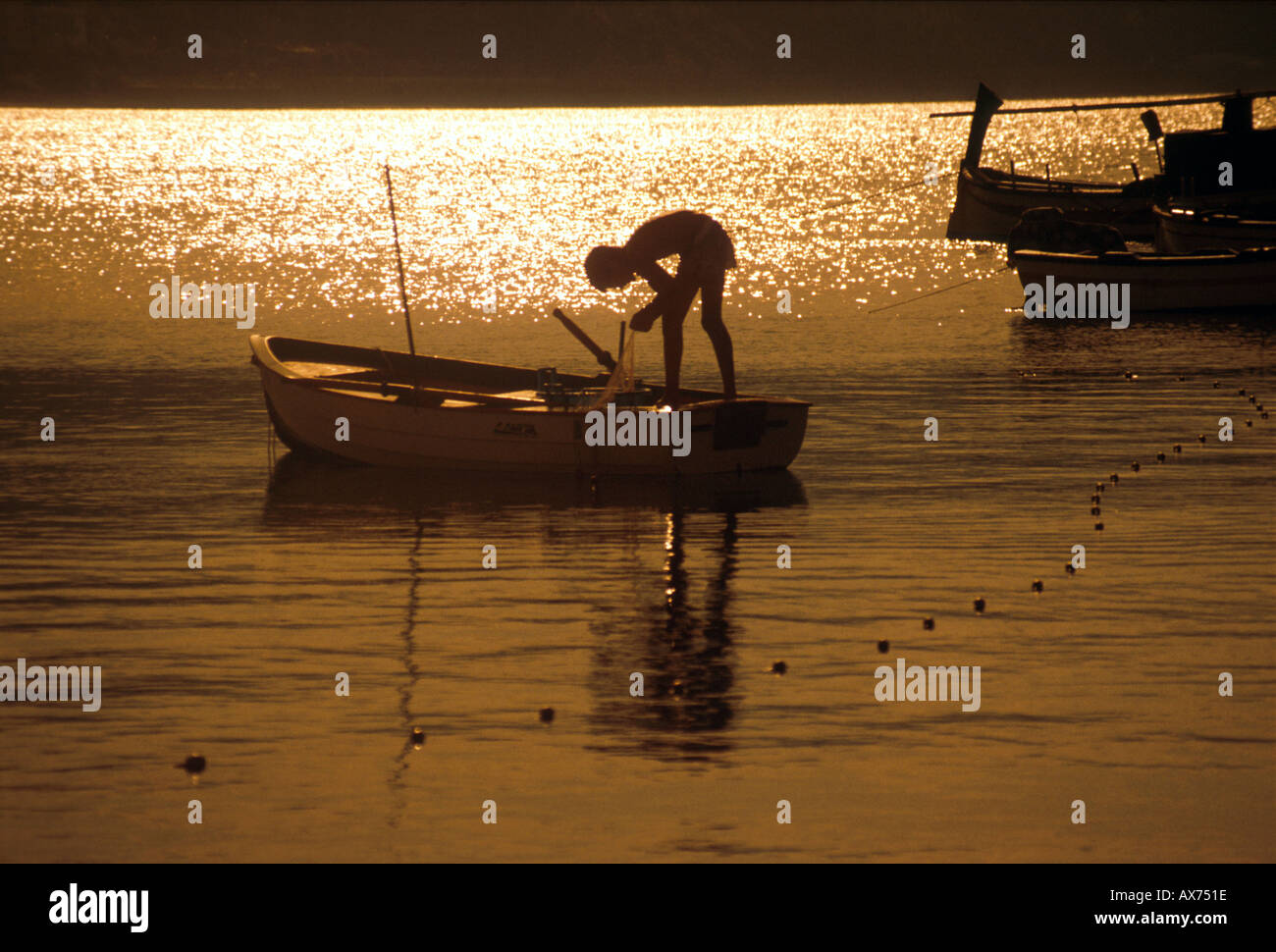 Boy in a fishing boat Sicily Stock Photo - Alamy