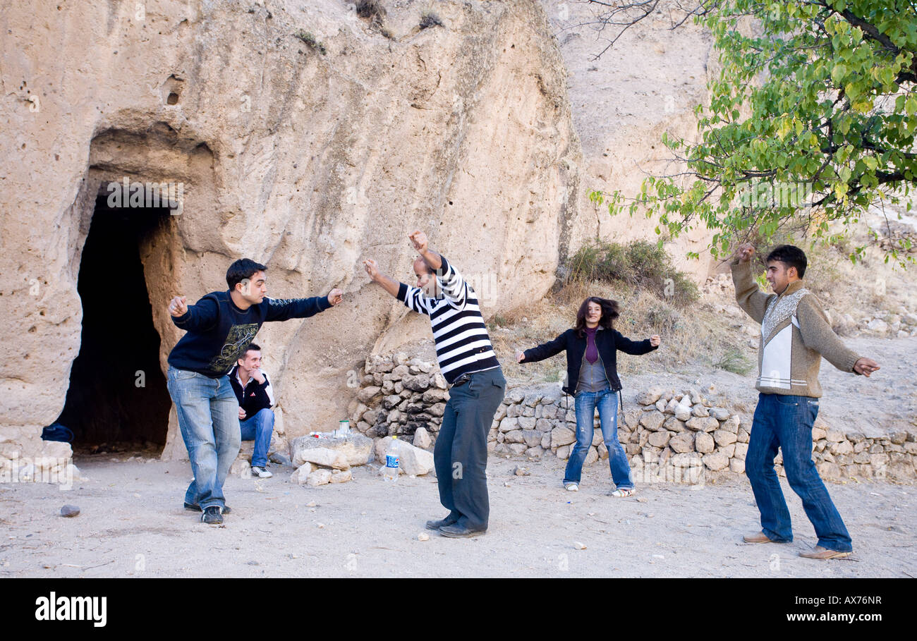 Cave Dancers A group of 5 young people make tea and dance at the door ...