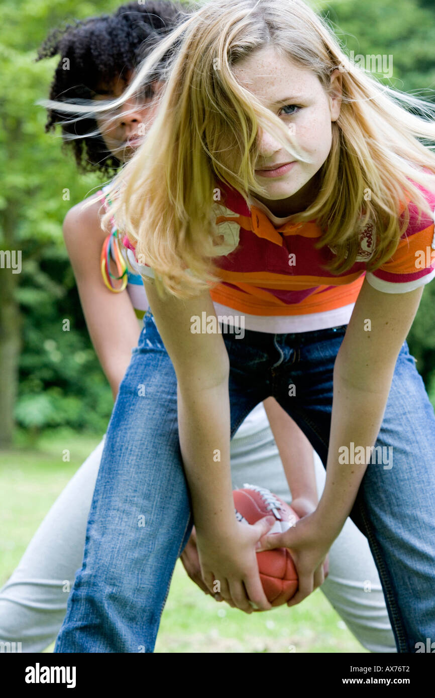 Two girls playing with a football Stock Photo - Alamy