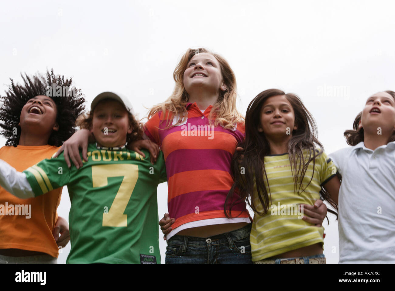 Low angle view of five children standing side by side Stock Photo - Alamy