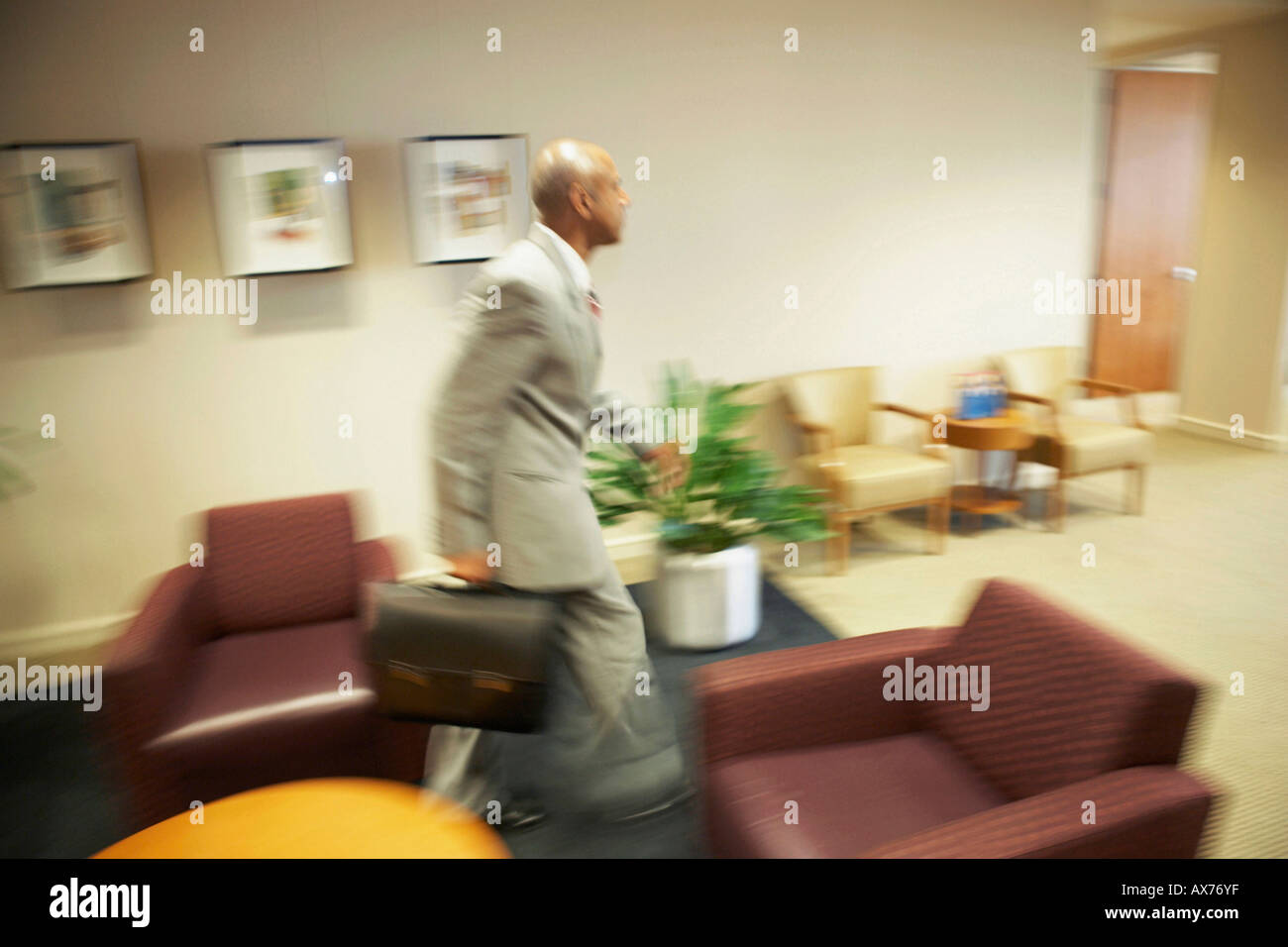 Side profile of a businessman carrying his bag Stock Photo - Alamy