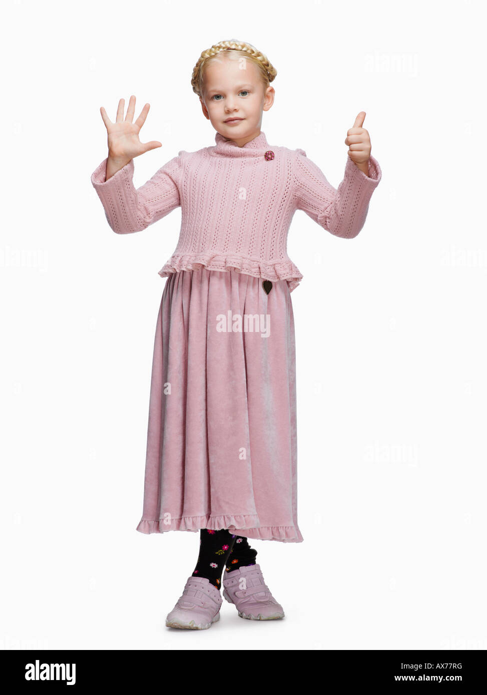Blond girl (6-8) in a dress, gesturing, portrait Stock Photo - Alamy