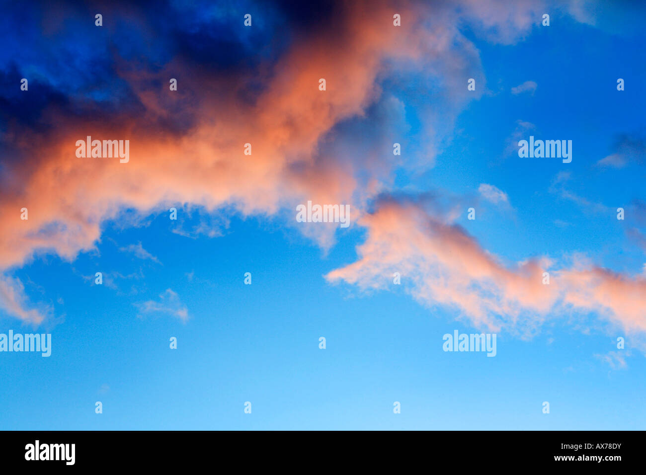 Pink Sunset Cloud Formation against Blue Sky Stock Photo - Alamy